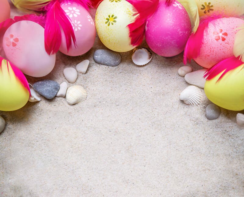 Sand Texture with Colorful Easter Eggs, Feather and Seashells on the ...