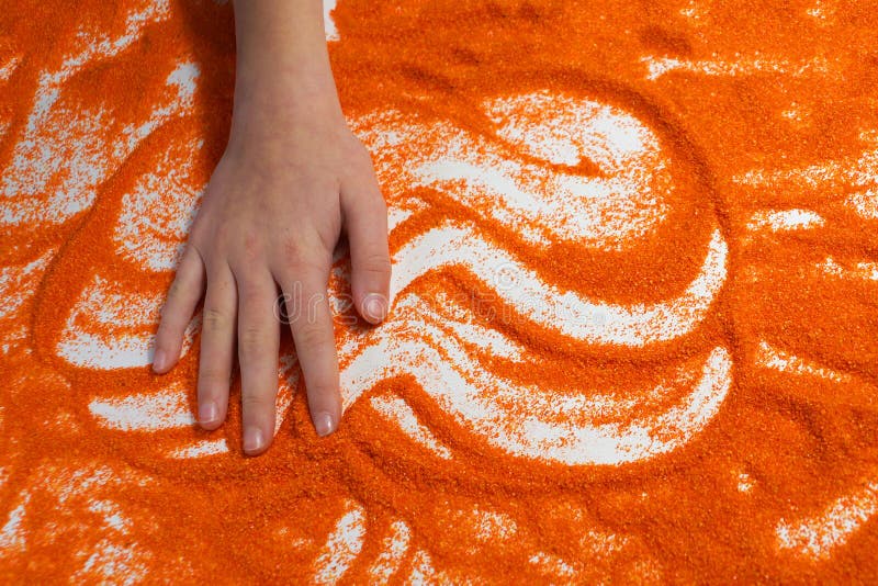 Sand Therapy Session, a Child`s Hand Touches the Orange Sand Stock ...