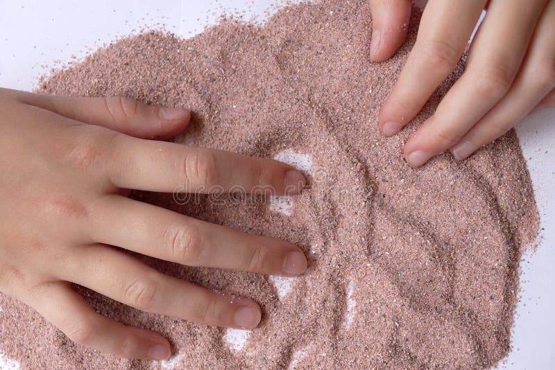 Sand Therapy, Two Hands Draw with Pink Sand on a White Table Stock ...