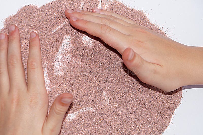 Sand Therapy, Two Hands Draw with Pink Sand on a White Table Stock ...