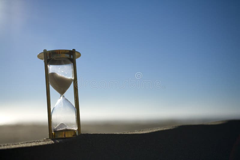 Sand Timer on Pebble Beach stock image. Image of warming - 25585279