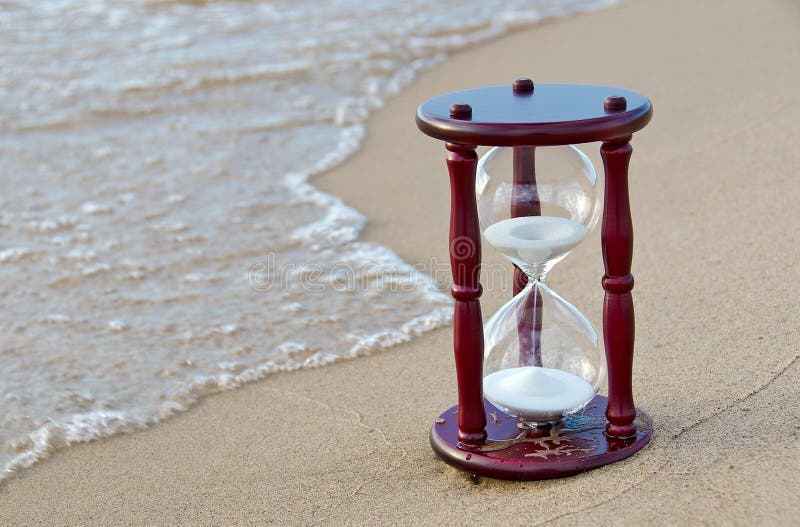 Sand timer on the seashore stock image. Image of hourglass - 44031089