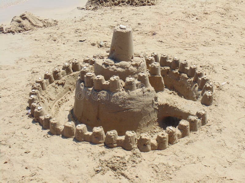 Sand tower on the beach stock photo. Image of beautiful - 123915404