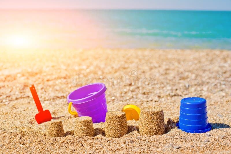 Sand toys on the beach stock image. Image of beach, colorful - 149068759