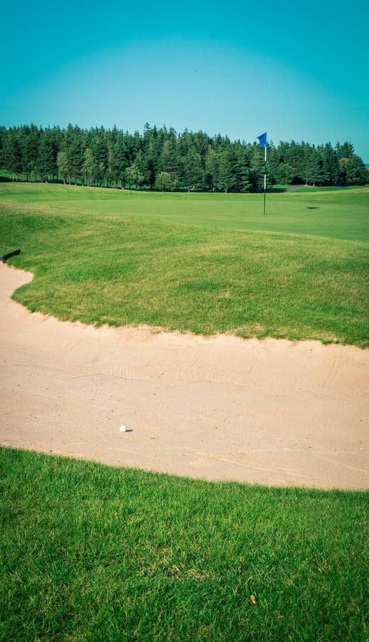 Sand trap on a golf course stock photo. Image of sport - 93106118
