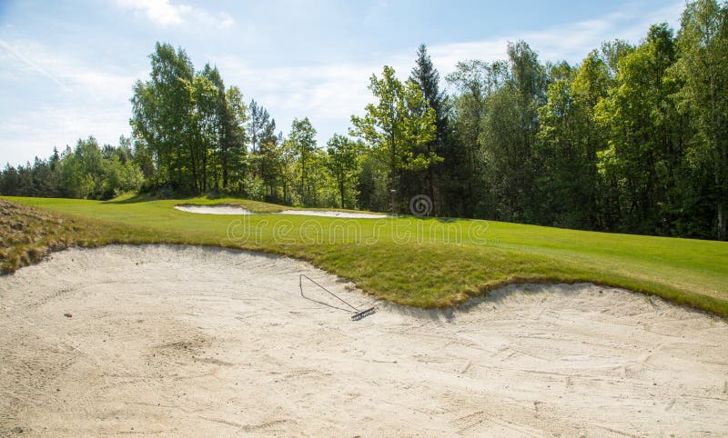 Sand Trap, Rake in a Golf Course Sand Bunkers, Raking the Sand Stock ...