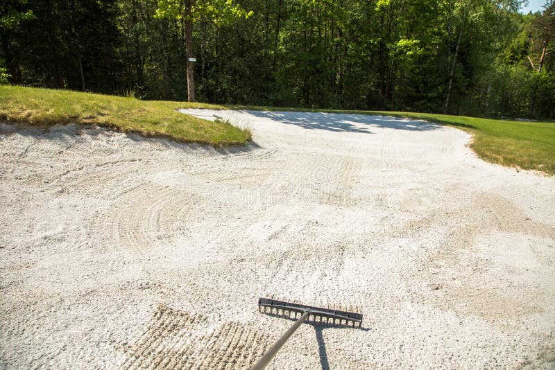 Sand Trap, Rake in a Golf Course Sand Bunkers, Raking the Sand Stock ...
