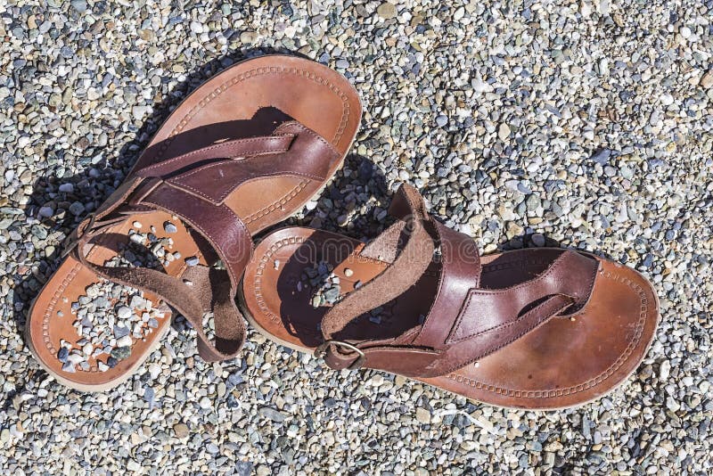 Sandals on a rocky beach stock photo. Image of pair, weather - 32314322