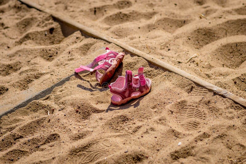Sandals And Footprints In The Sand Stock Photo - Image of sandals ...