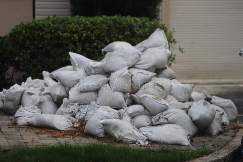 Sandbags Stacked in Front of Foliage Stock Image - Image of garden ...