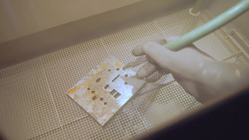 Sandblasting. Sandblasting a Rusty Iron Part in a Special Box. Stock ...