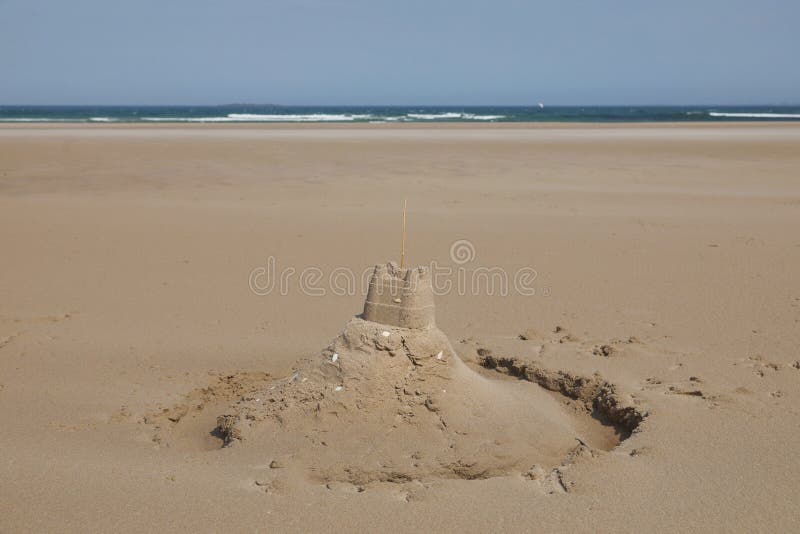 Sandcastle with Moat on the Beach Stock Photo - Image of spade, play ...