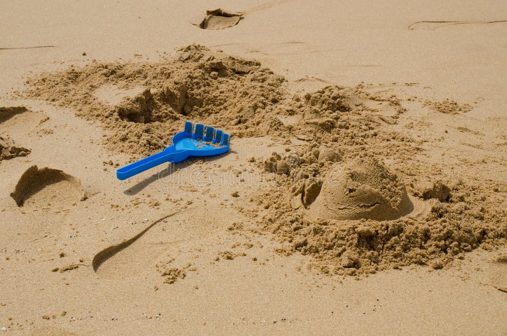 Sandcastle stock photo. Image of beach, fallen, rake - 71311616
