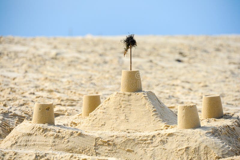 Sandcastle with Wall and Towers on the Beach Stock Photo - Image of ...