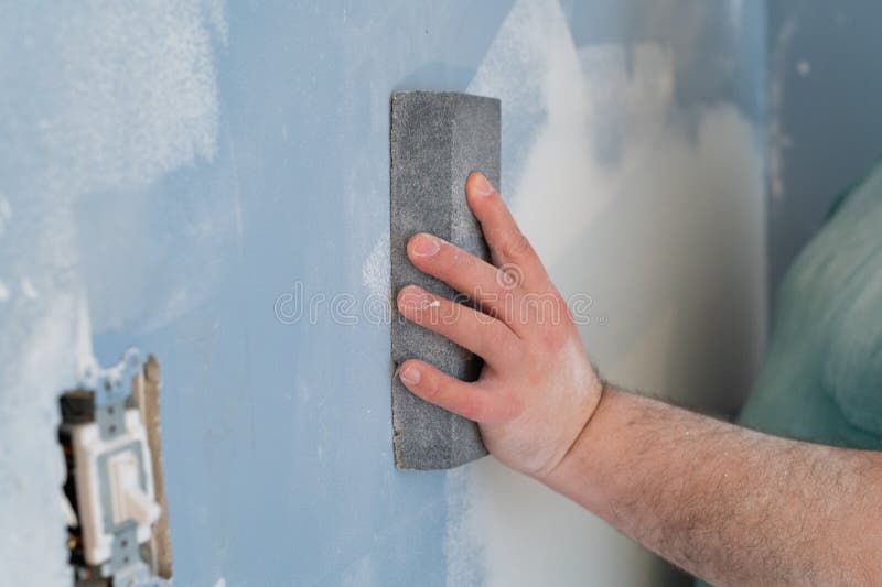 Sanding Gypsum Plaster by Hand Using Sandpaper Wall Person Stock Image ...