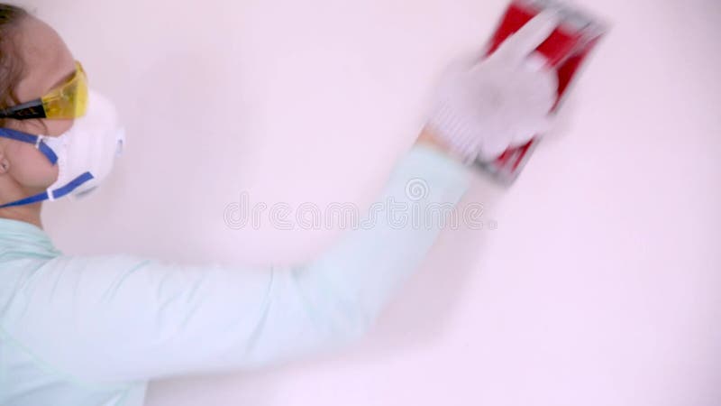 Sanding and Leveling the Wall after Applying the Putty Stock Footage ...