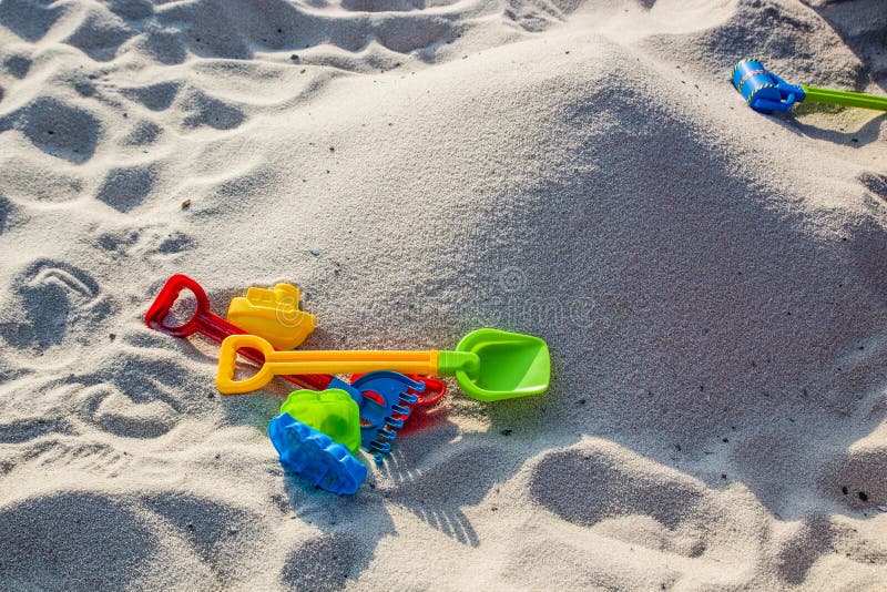 Sandpile and toys stock image. Image of shovel, tool - 54257729