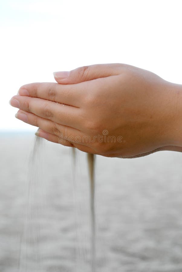 Woman with sand in hands stock image. Image of close - 20727719