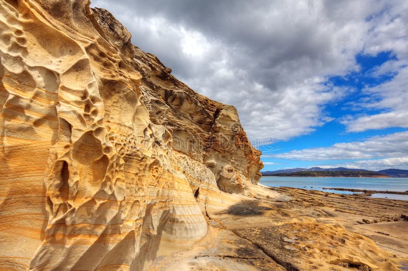 Sandstone beach stock photo. Image of beach, ocean, cliff - 19191998