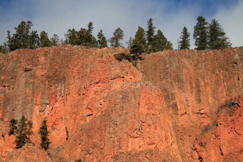 A Red Sandstone Cliff Side and a Dry Creek Bed at the Bottom. Stock ...