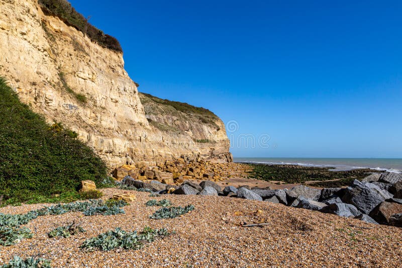 The Sandstone Cliffs at Pett Level with a Clear Blue Sky Overhead Stock ...