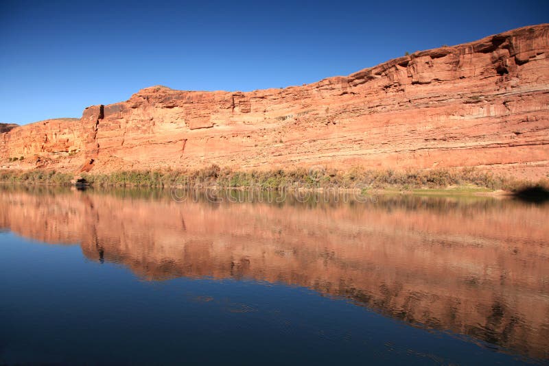 Sandstone Cliffs Reflected in the Colorado River Stock Photo - Image of ...