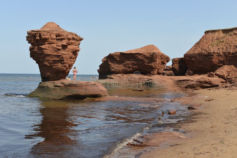 Sandstone Rock Formations on a Red Sand Beach Stock Image - Image of ...