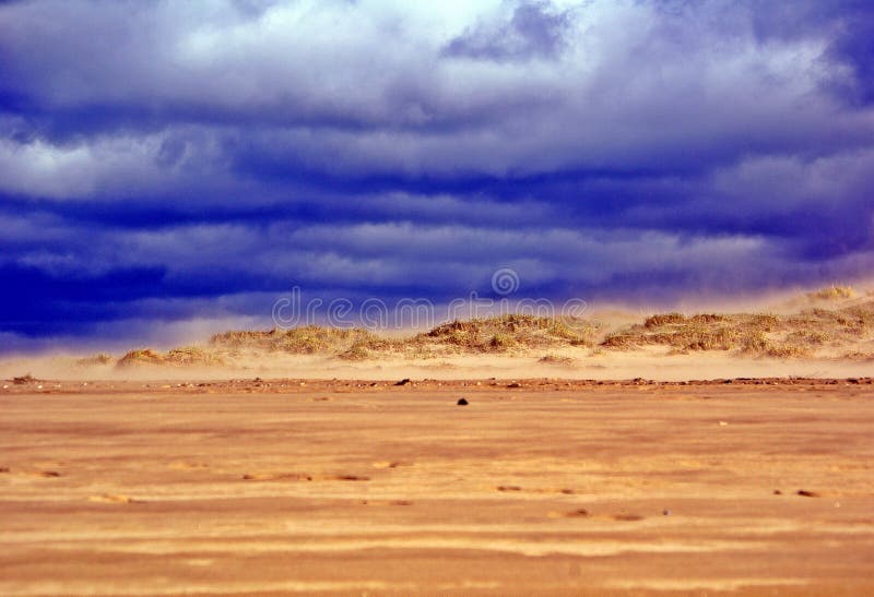 Sandstorm on a beach stock image. Image of surreal, dunes - 52280921