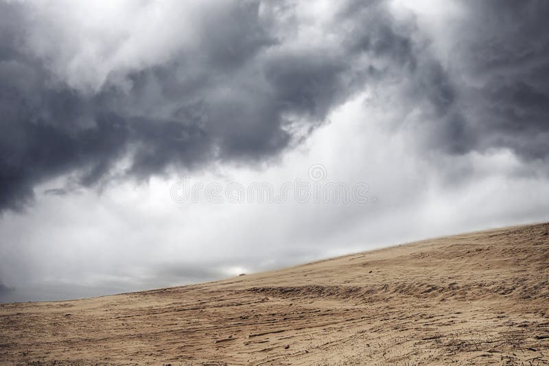 Sandstorm in a Dry Desert Under a Cloudy Sky Stock Photo - Image of ...