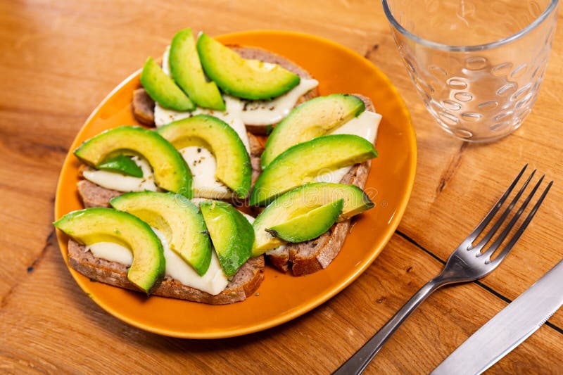 Sandwich with Avocado and Cheese. Tasty Breakfast Close Up Stock Photo ...