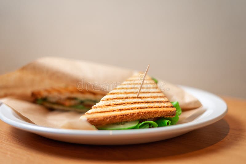 Sandwich B on a White Plate on a Wooden Table Close-up Stock Photo ...
