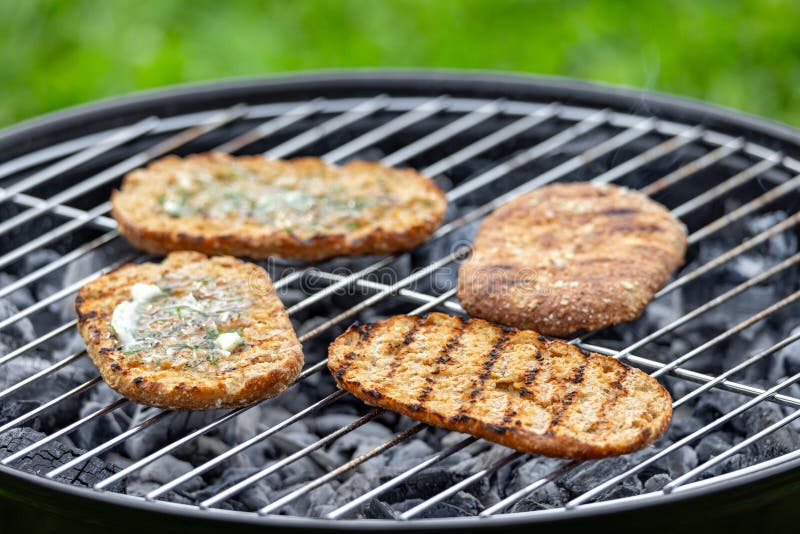 Bread buns on grill stock photo. Image of herb, grass - 333936956