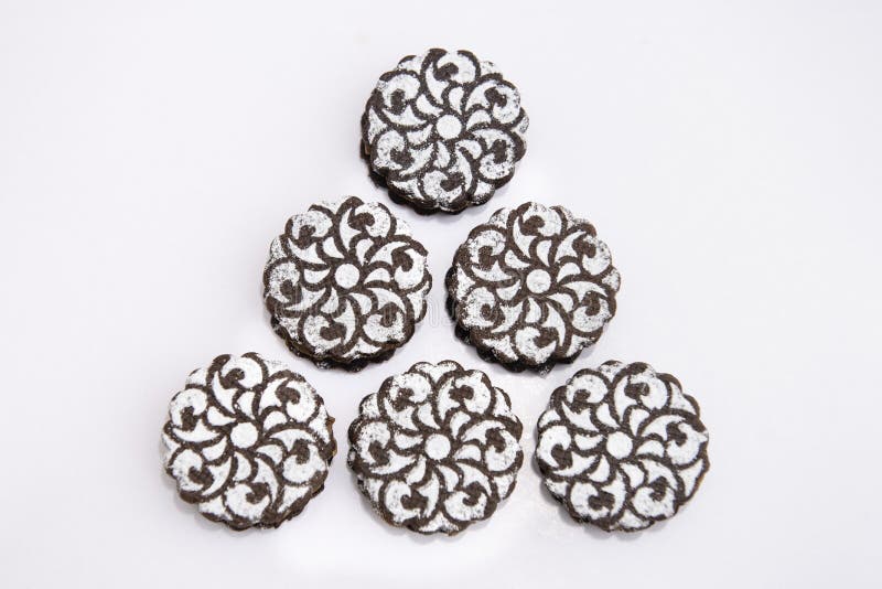 Sandwich Brown Biscuits with White Stencil Stock Photo - Image of stack ...