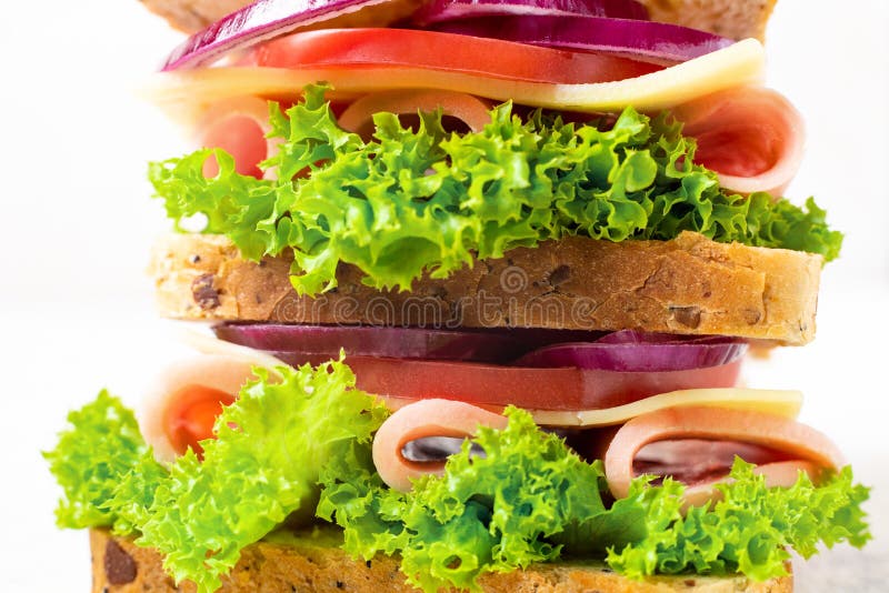 Sandwich with Ham Cheese Tomatoes Lettuce Onions. Macro of Multi-layer ...