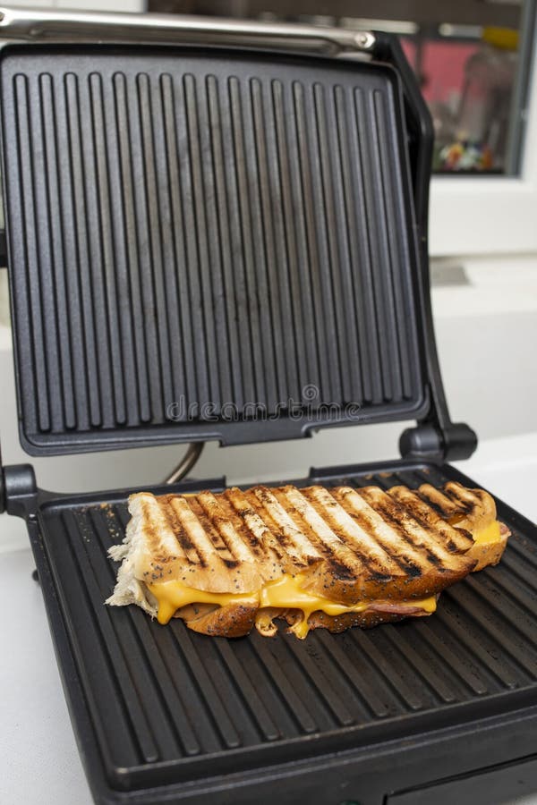Sandwich with Ham and Melting Cheese in a Panini Machine Grill , Side ...