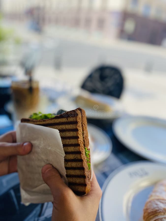 Sandwich in Hand on the Terrace Stock Image - Image of freshness ...