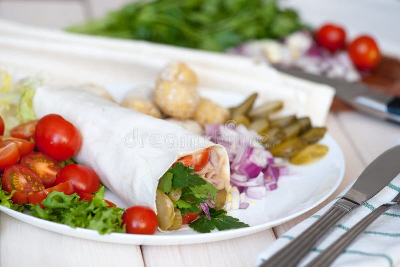 Sandwich Twisted Roll with Lettuce, Cucumbers, Cherry Tomatoes, Onion ...