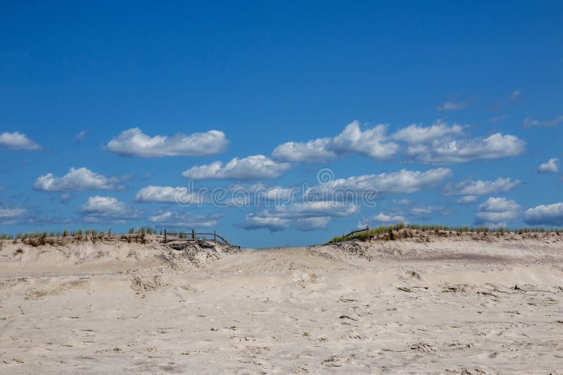 Sandy Beach Dunes and Clouds in a Blue Sky Above Stock Image - Image of ...