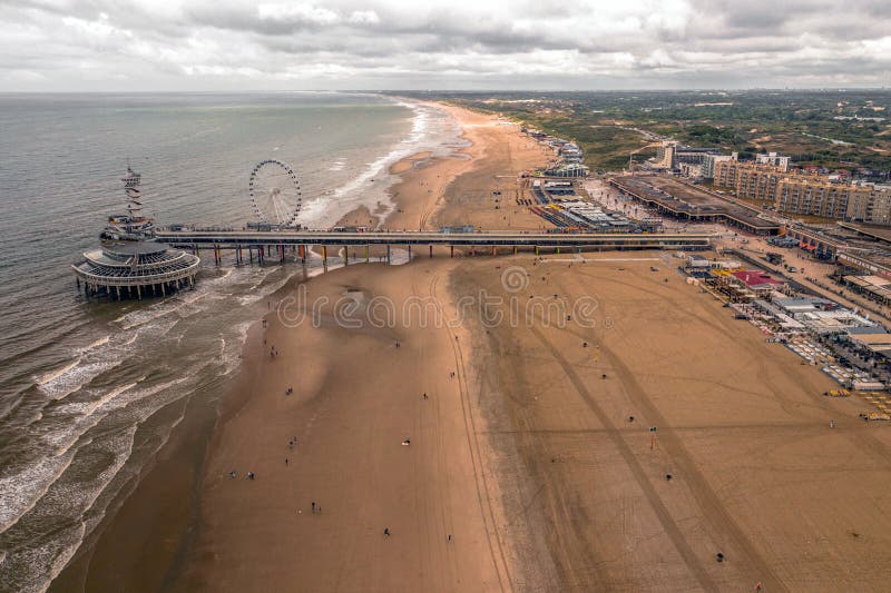 Sandy Beach with a Ferris Wheel and Pier Stock Photo - Image of ocean ...