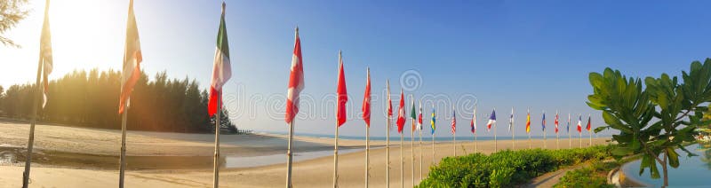 Sandy Beach and Flags of the Different Countries on the Seashore ...