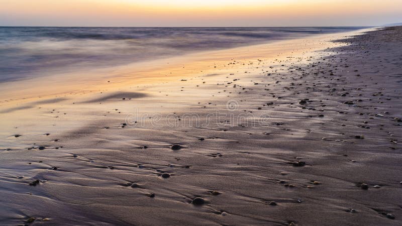 Sandy Beach Full of Shells at Sunset Stock Image - Image of color ...