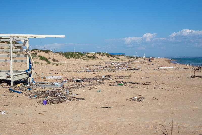 Sandy Beach with Garbage Carried by the Wave. Ocean Pollution Stock ...