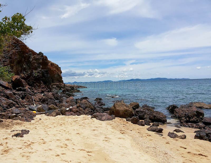 Sandy Beach Mixed with Rocks Stock Image - Image of cliff, coast: 228606251