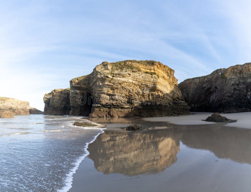 Sandy Beach Panorama with Tidal Pools and Jagged Broken Cliffs Behind ...