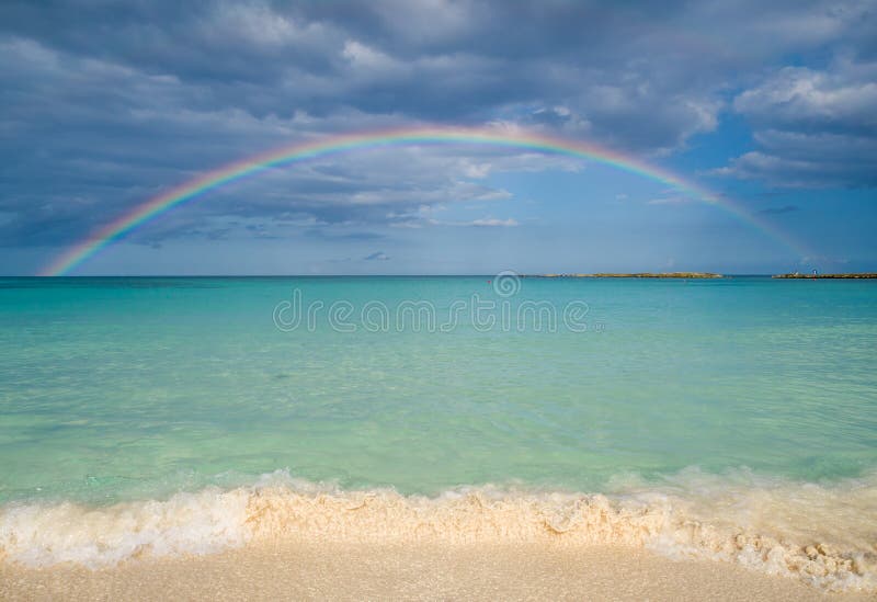 Sandy beach and rainbow stock image. Image of holiday - 47111497