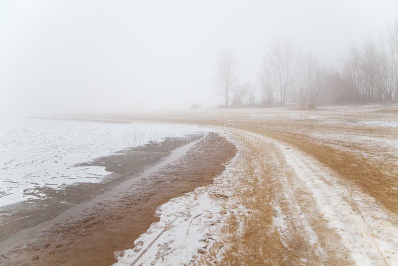 Sandy Beach by the River in the Fog in Winter Stock Photo - Image of ...