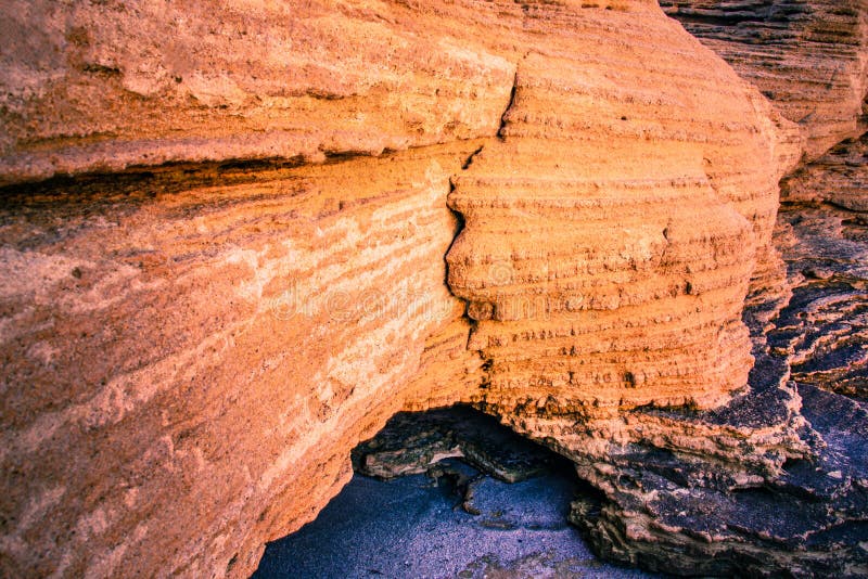 Sandy Beach Rocks Colored in Orange Under the Rays of the Rising Sun ...