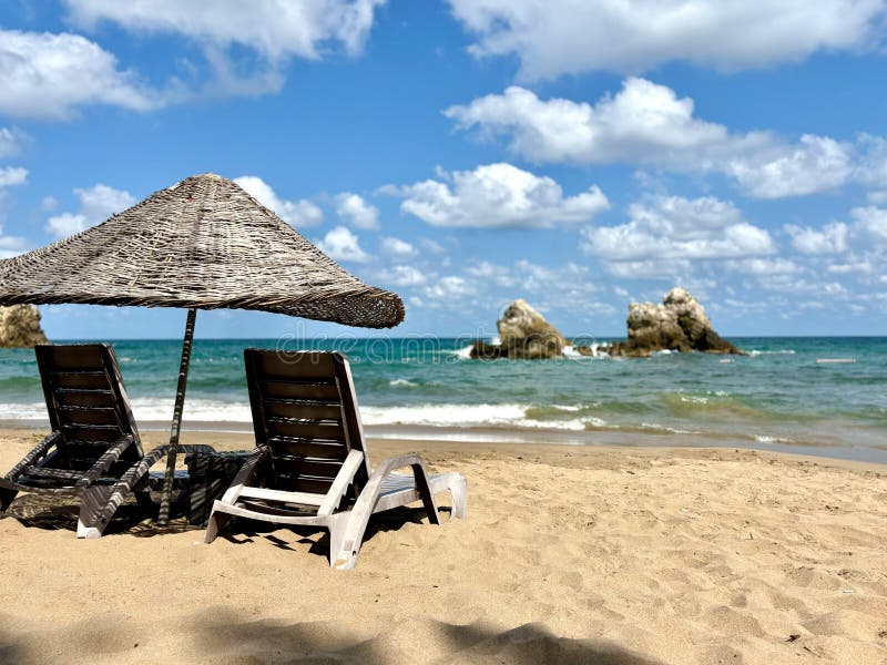 Sandy Beach with Rows of Deck Chairs and Umbrellas. Tranquil Scenery ...