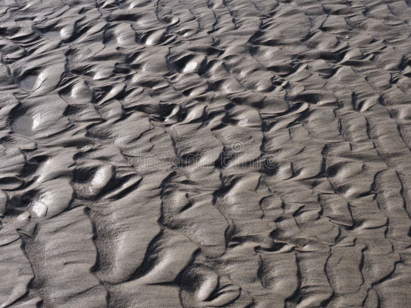 Sandy Beach with Sculptured Patterns Made from Waves. Stock Photo ...