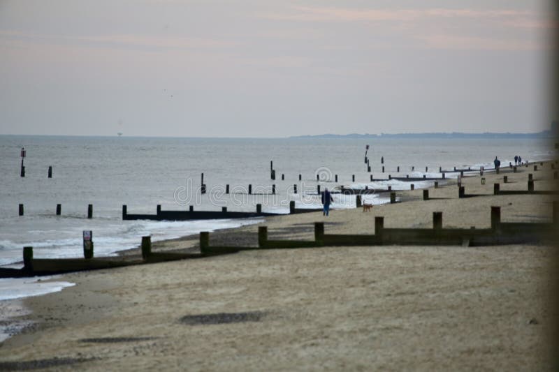 Sandy Beach with Sea Defences Stock Photo - Image of coast, defence ...